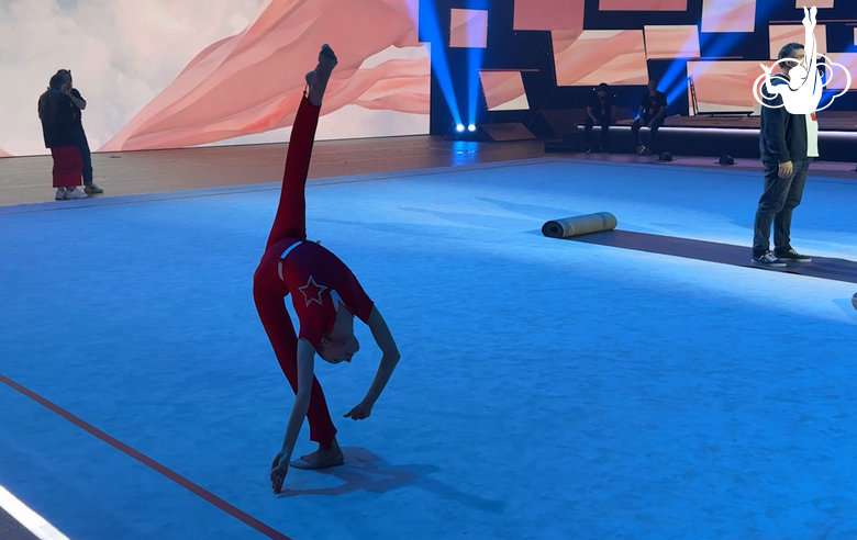 Olympic champion Alina Kabaeva looked at gymnast Daria Dotsenko before the festival in Sirius